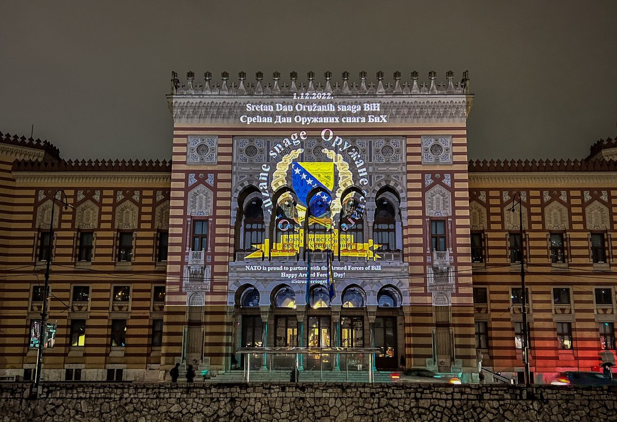 Symbol of BiH Armed Forces illuminated across landmark Sarajevo City Hall